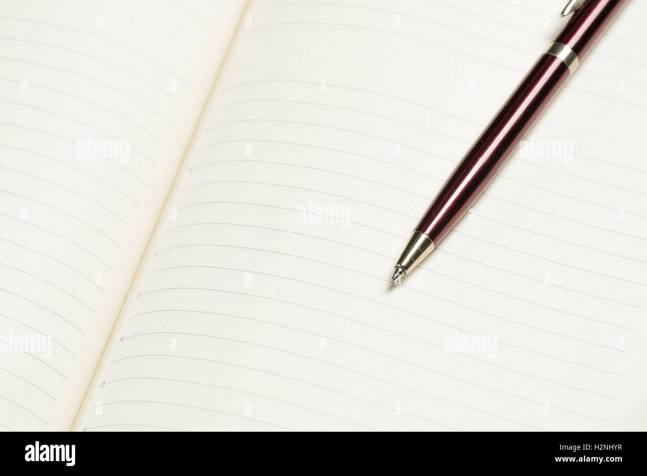 pen and open notepad Stock Photo - Alamy