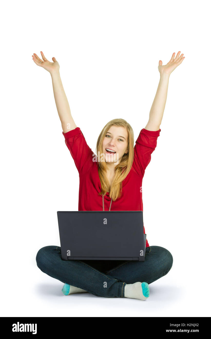 Attractive woman cheering while browsing with a laptop computer Stock ...
