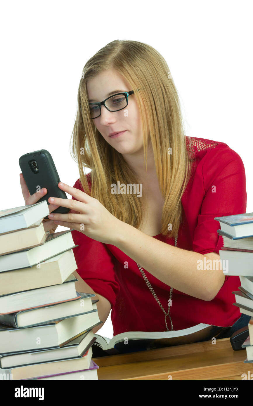 Student using cellphone instead of studying Stock Photo - Alamy