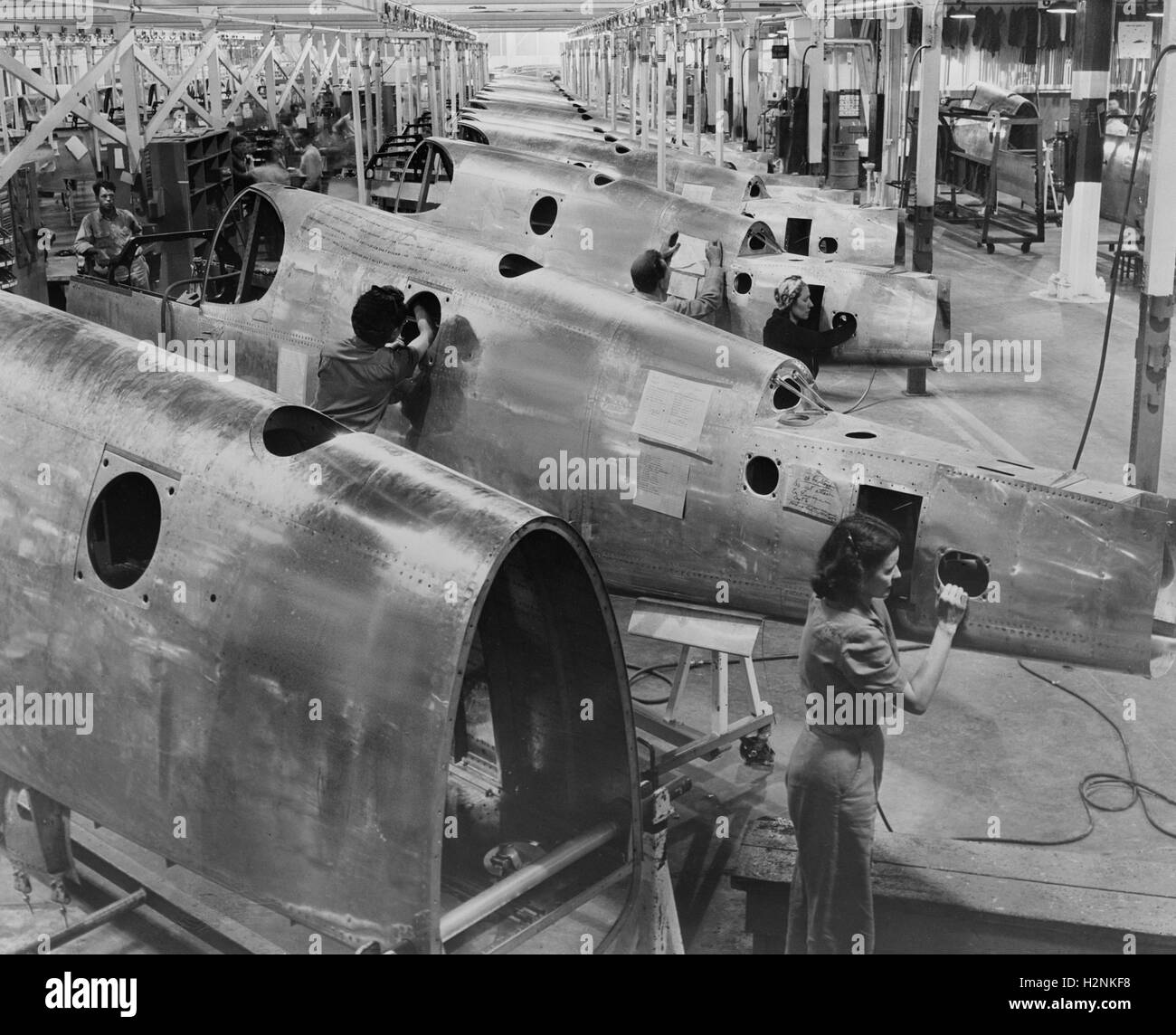 Workers on P-51 Fuselage Overhead Conveyor Line, North American ...