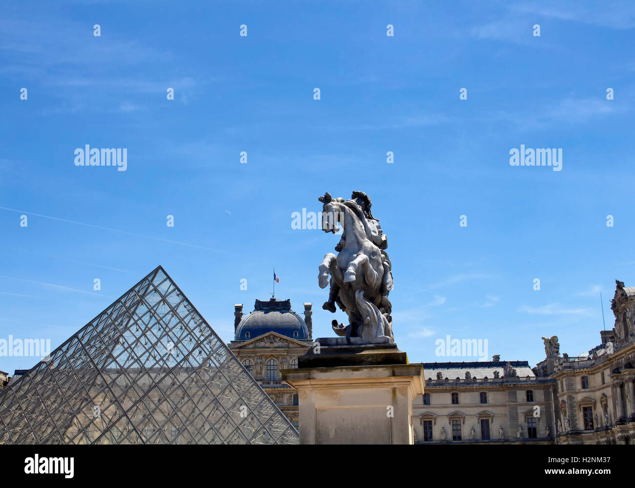 Statue of king Louis XIV in the courtyard of the Louvre museum. Made by ...