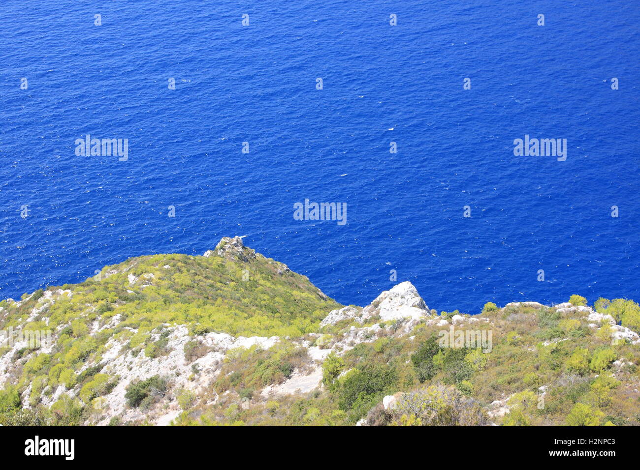 Beautiful Deep blue sea and rocks in Greece Stock Photo - Alamy