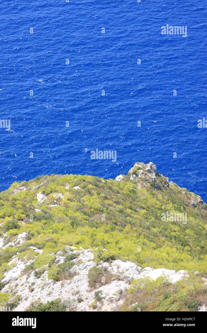 Beautiful Deep blue sea and rocks in Greece Stock Photo - Alamy