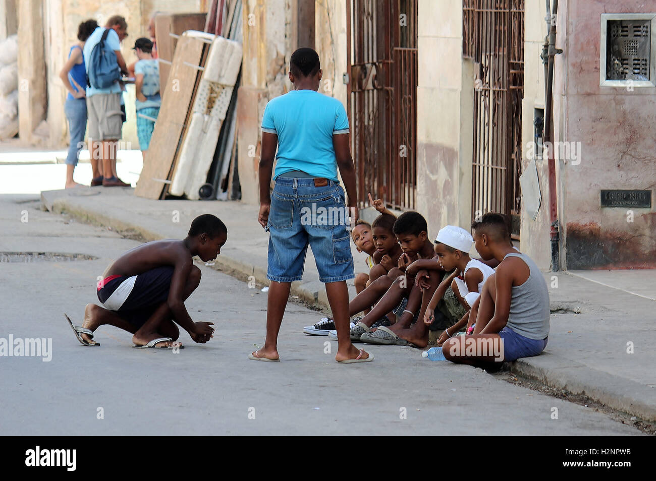 Children playing marbles hi-res stock photography and images - Alamy