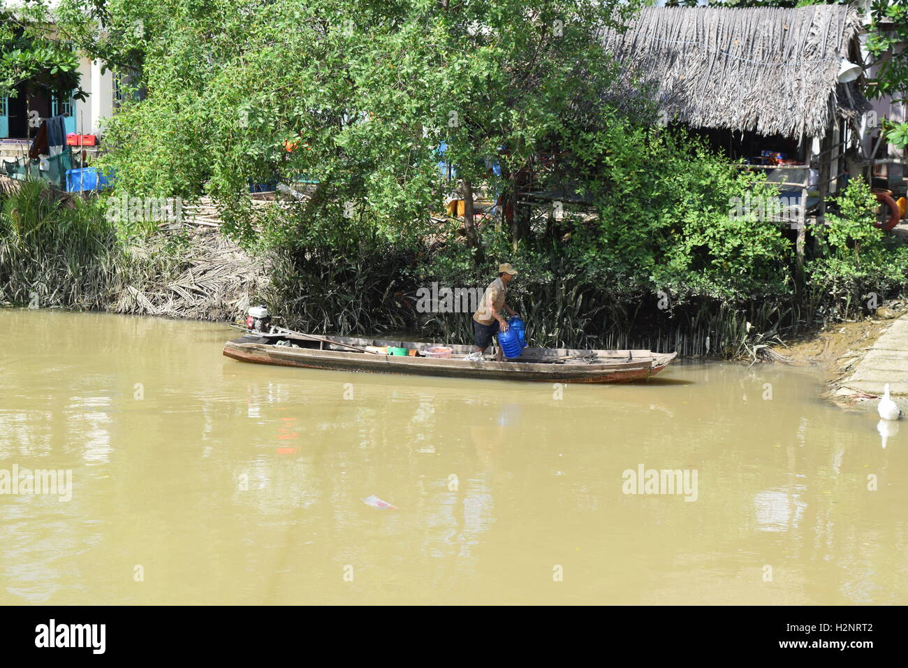 traditional asian fishing boat in river, vietnam Stock Photo - Alamy