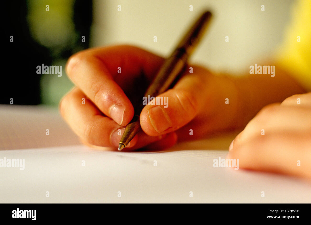 Hands of pupil doing homework Stock Photo - Alamy