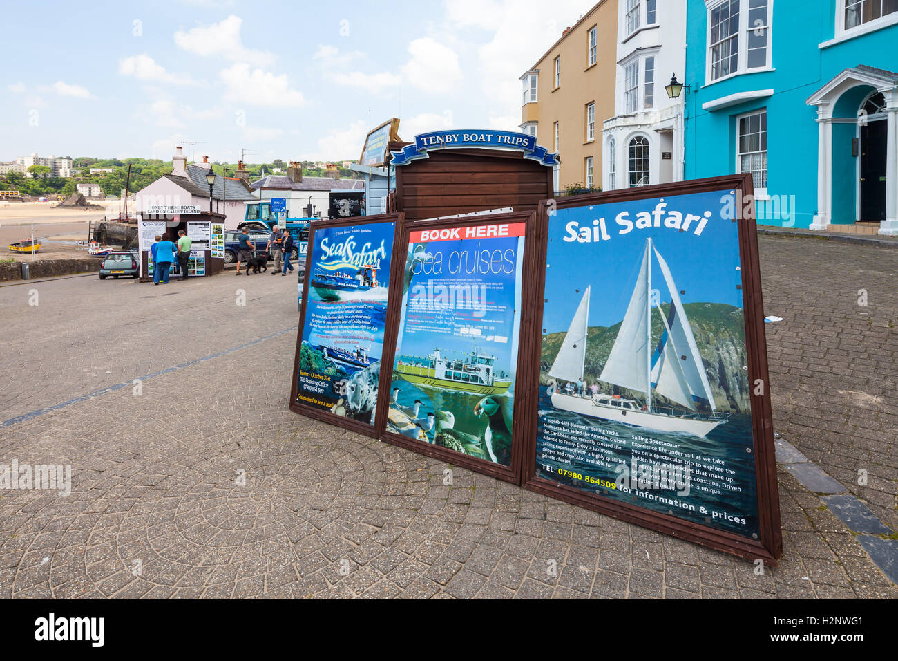Fishing trip signs at Tenby Stock Photo - Alamy
