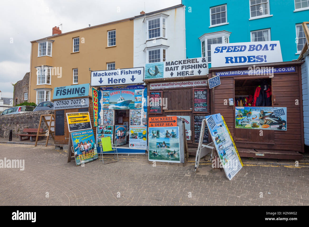 Fishing trip signs at Tenby Stock Photo - Alamy