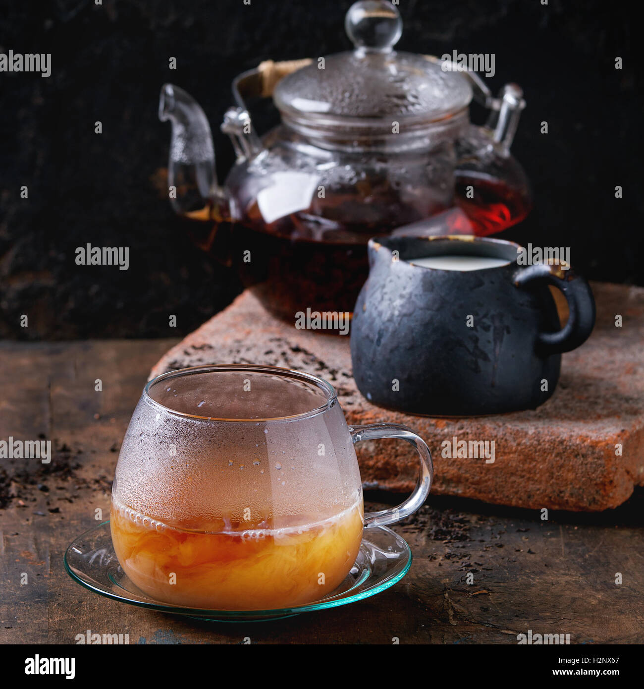 Cup of black tea with milk Stock Photo - Alamy