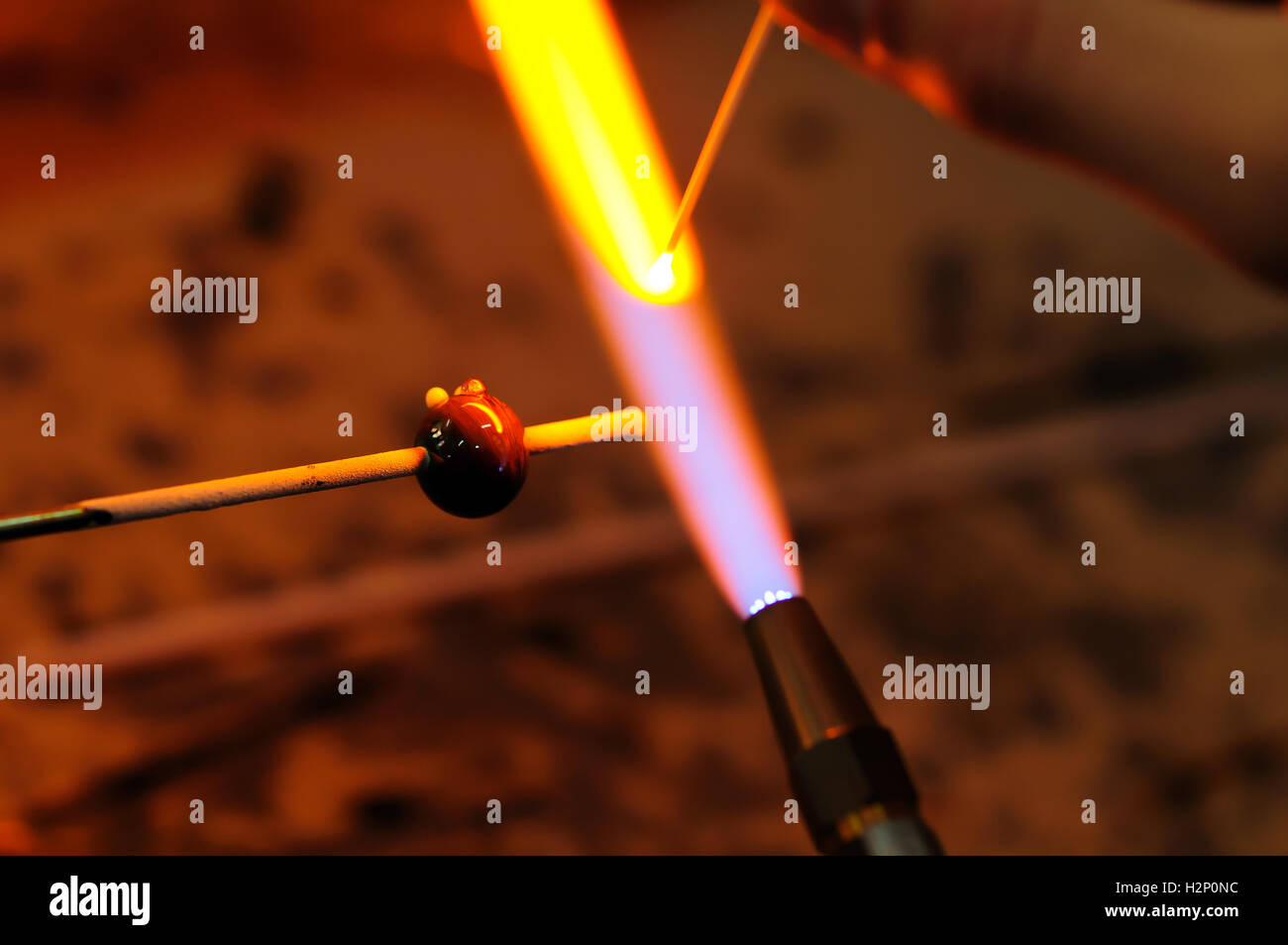 The art of shaping glass using fire Stock Photo - Alamy