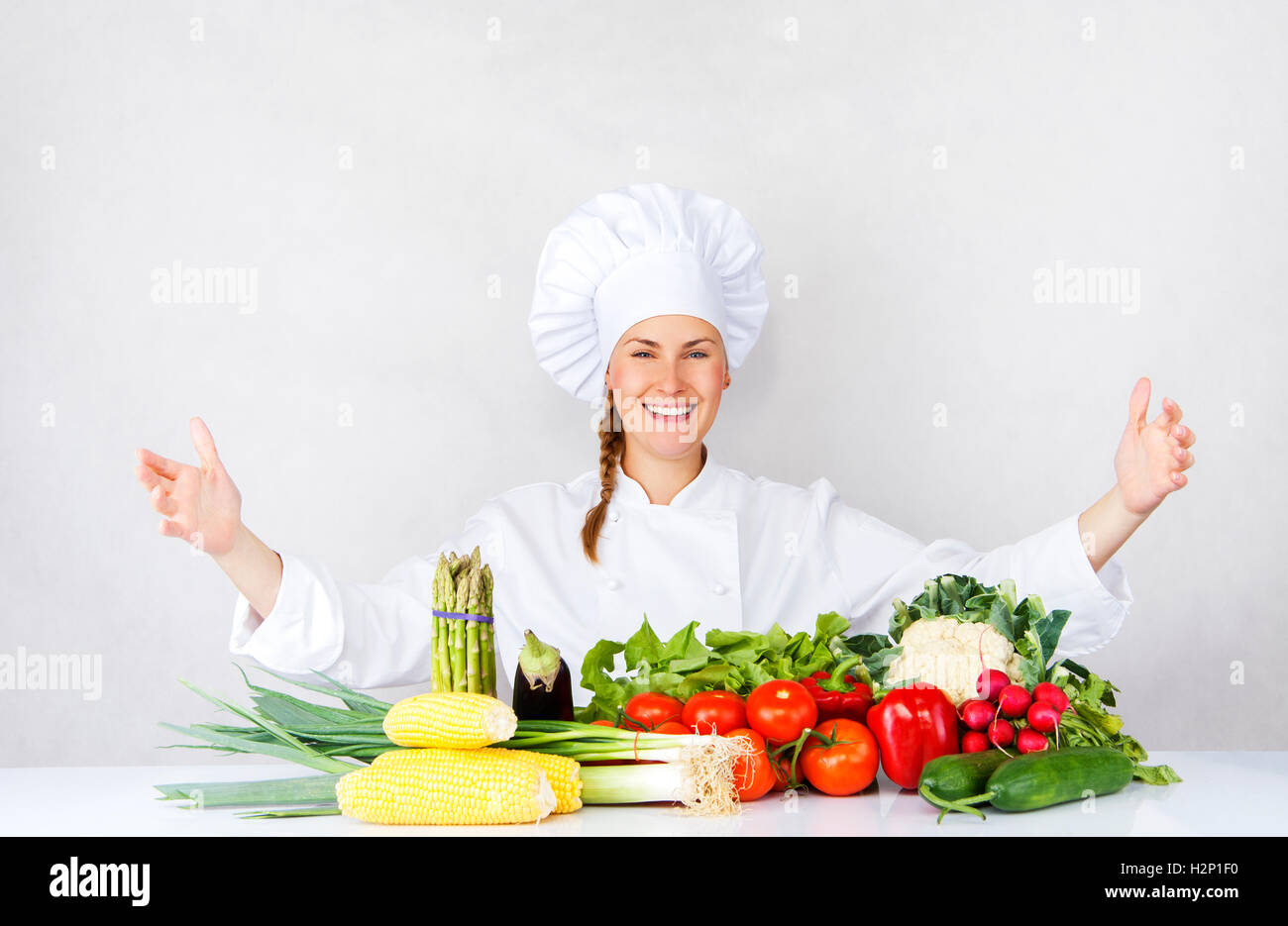 beautiful young chef woman prepare and decorating tasty food in kitchen ...