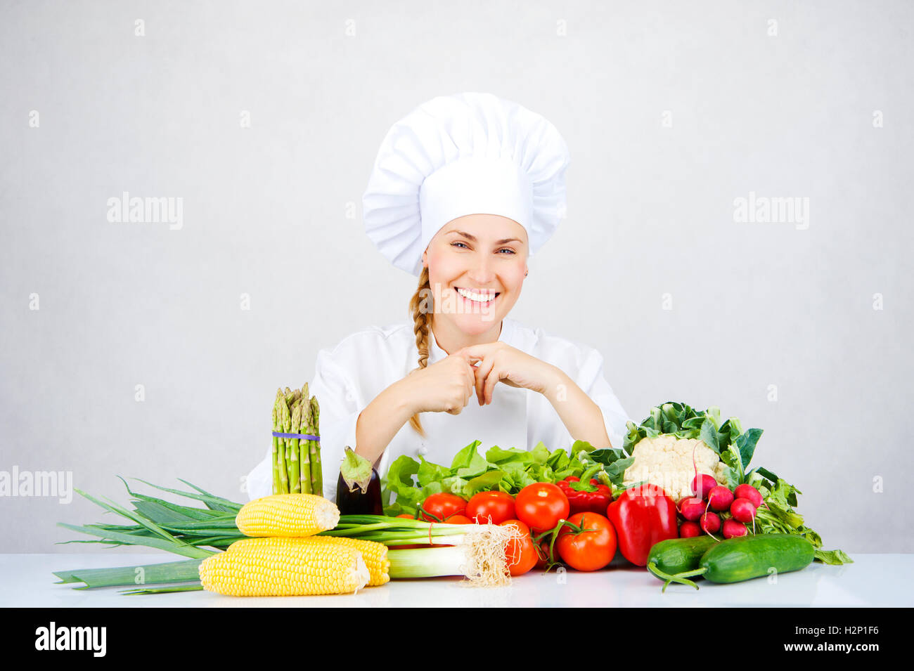 beautiful young chef woman prepare and decorating tasty food in kitchen ...