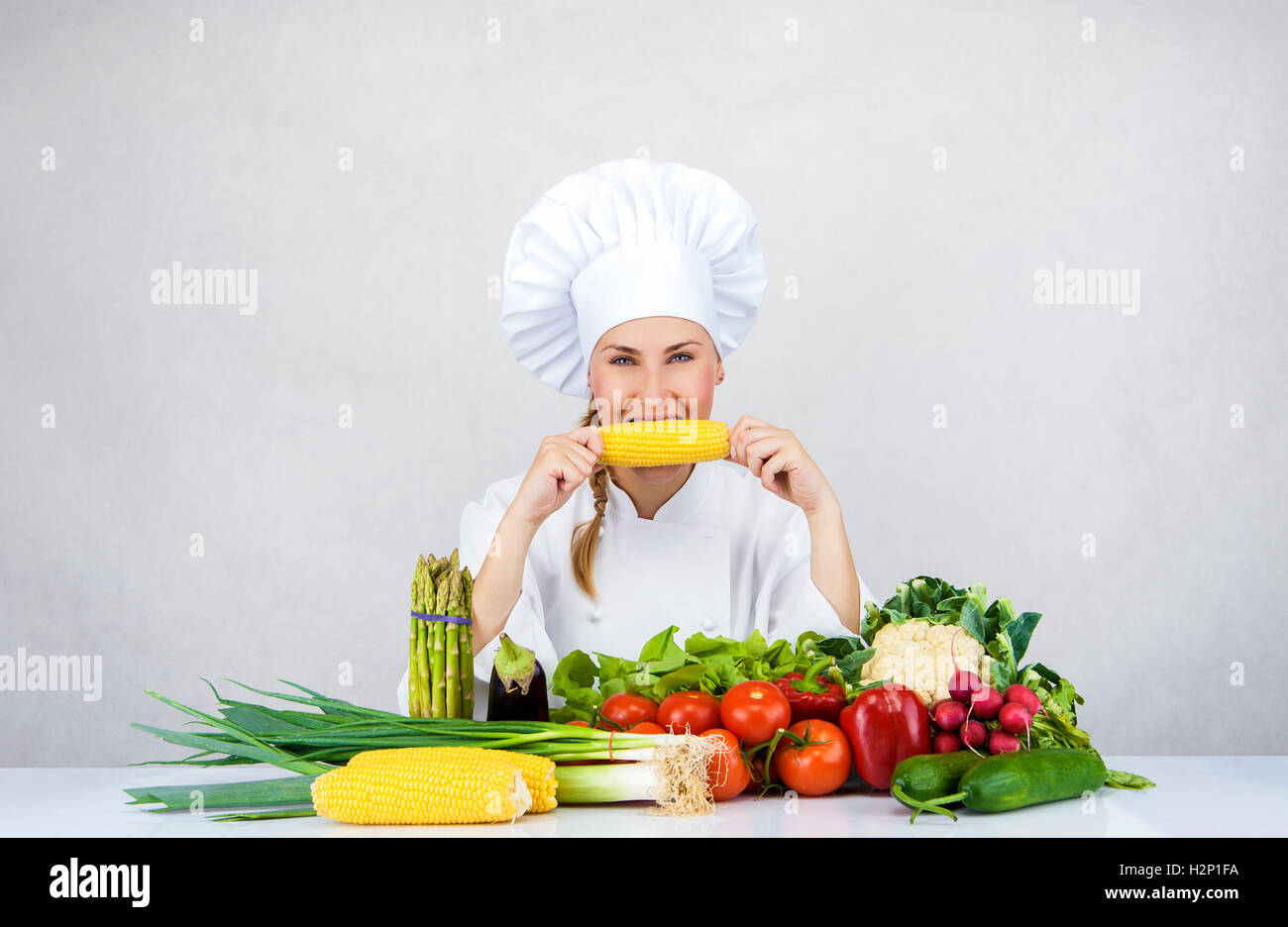 beautiful young chef woman prepare and decorating tasty food in kitchen ...