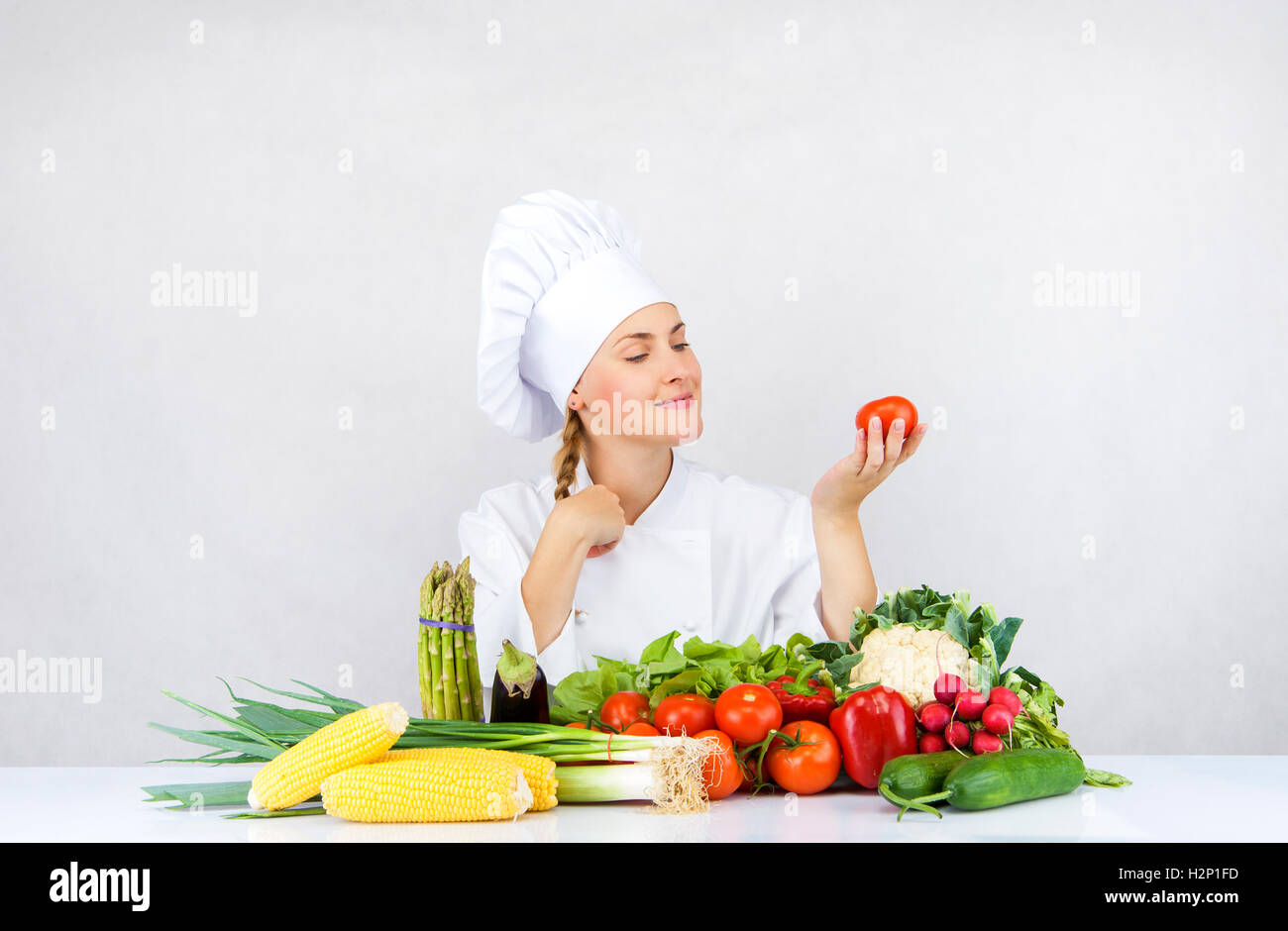 beautiful young chef woman prepare and decorating tasty food in kitchen ...