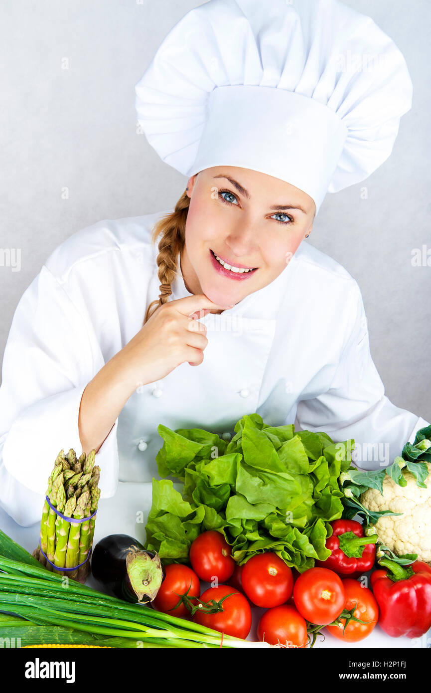 beautiful young chef woman prepare and decorating tasty food in kitchen ...