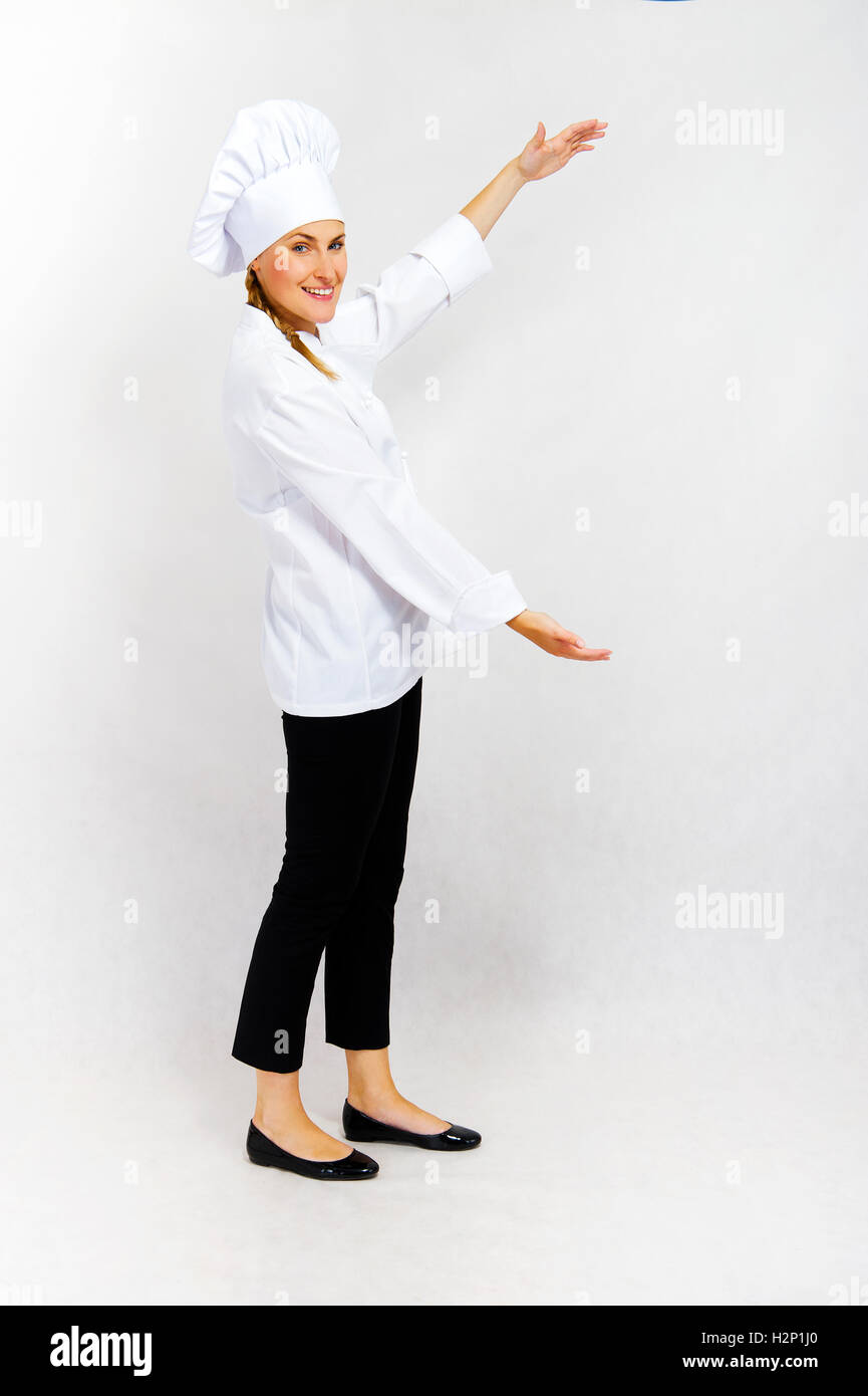Smiling woman chef welcoming you to her workplace Stock Photo - Alamy