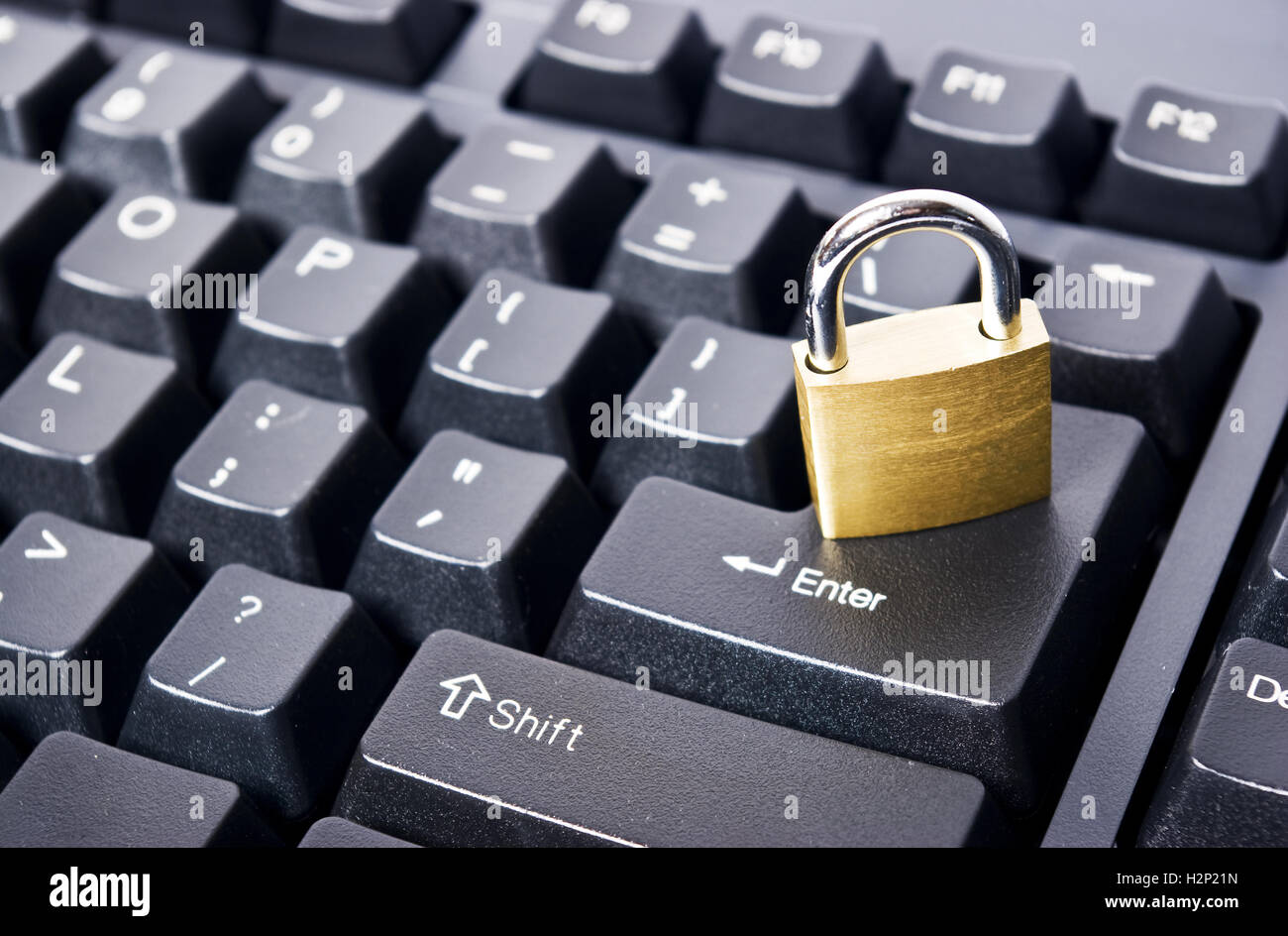 padlock on black keyboard in background Stock Photo - Alamy