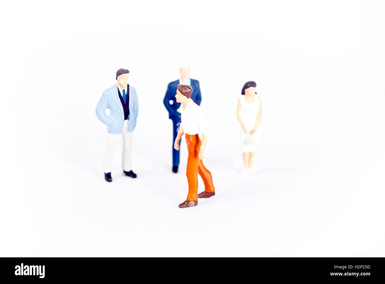 miniature people on white background Stock Photo - Alamy