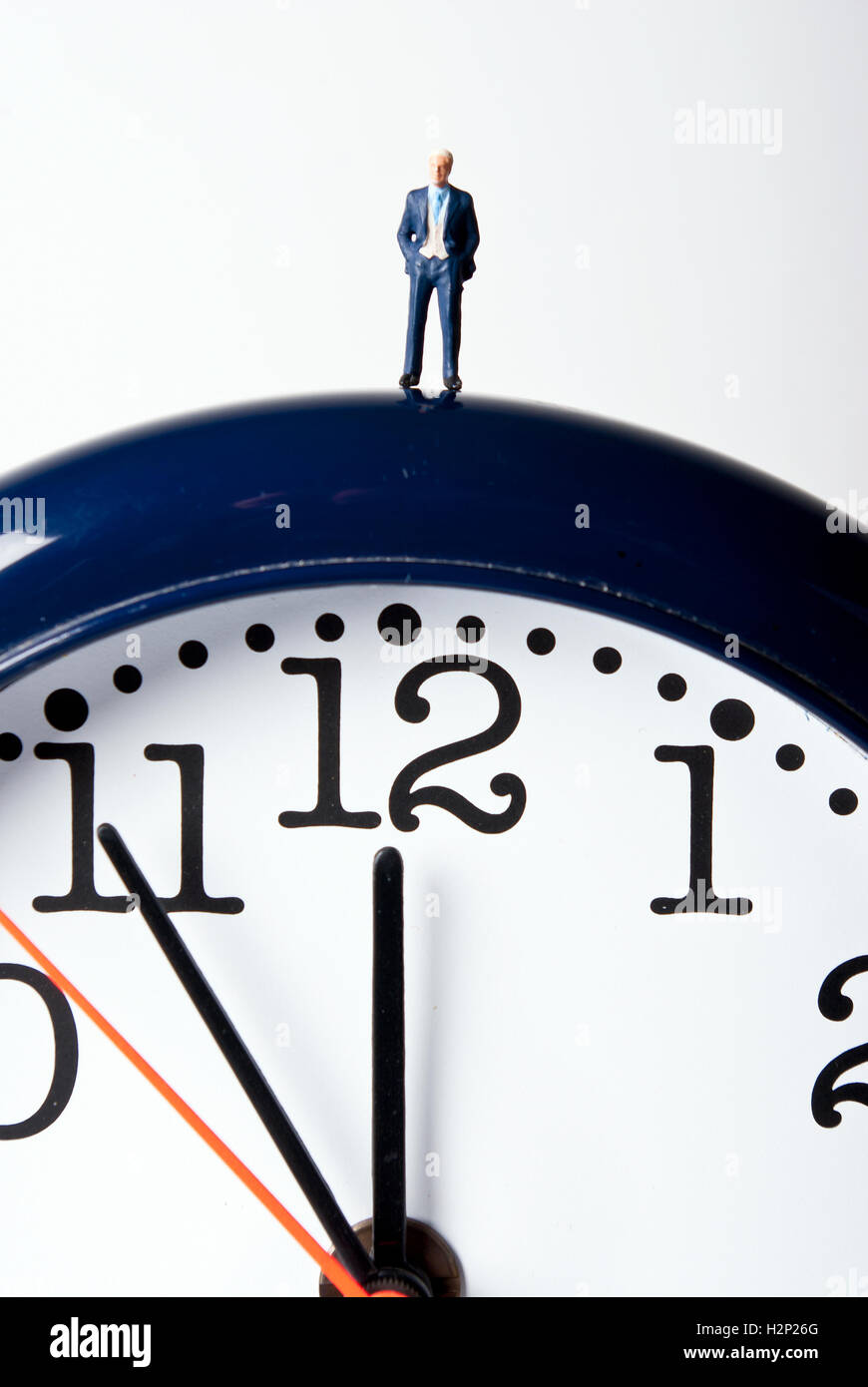 mano on the time clock Stock Photo - Alamy