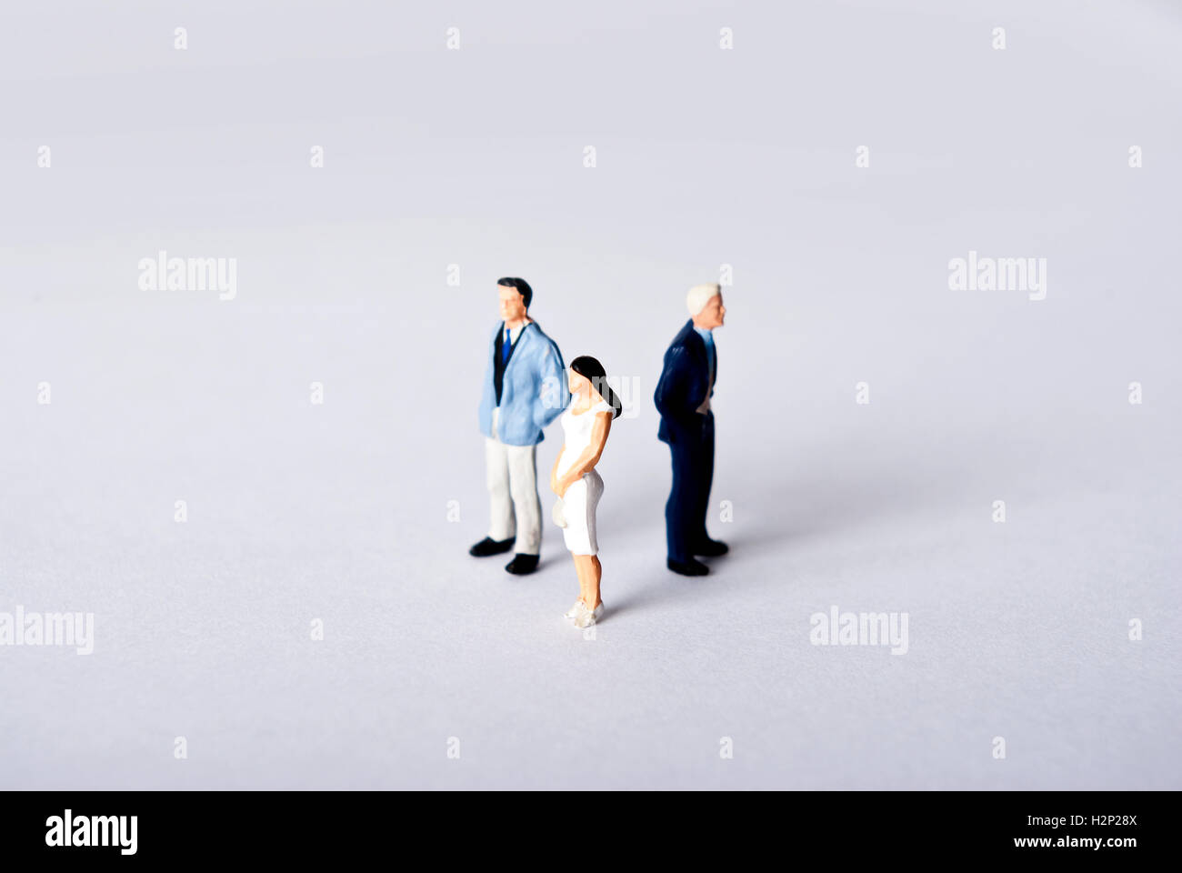 some miniature people on white background Stock Photo - Alamy