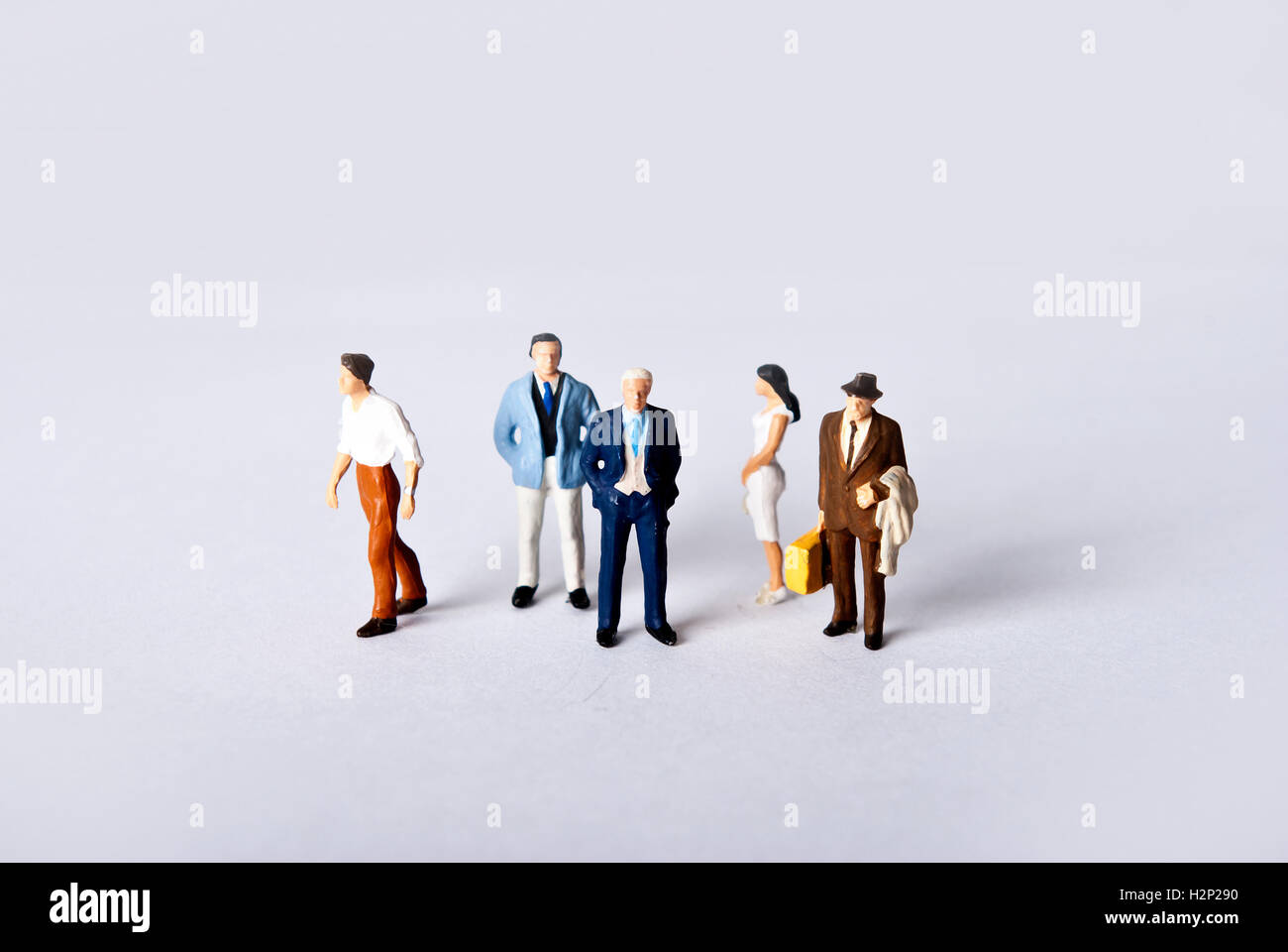 some miniature people on white background Stock Photo - Alamy