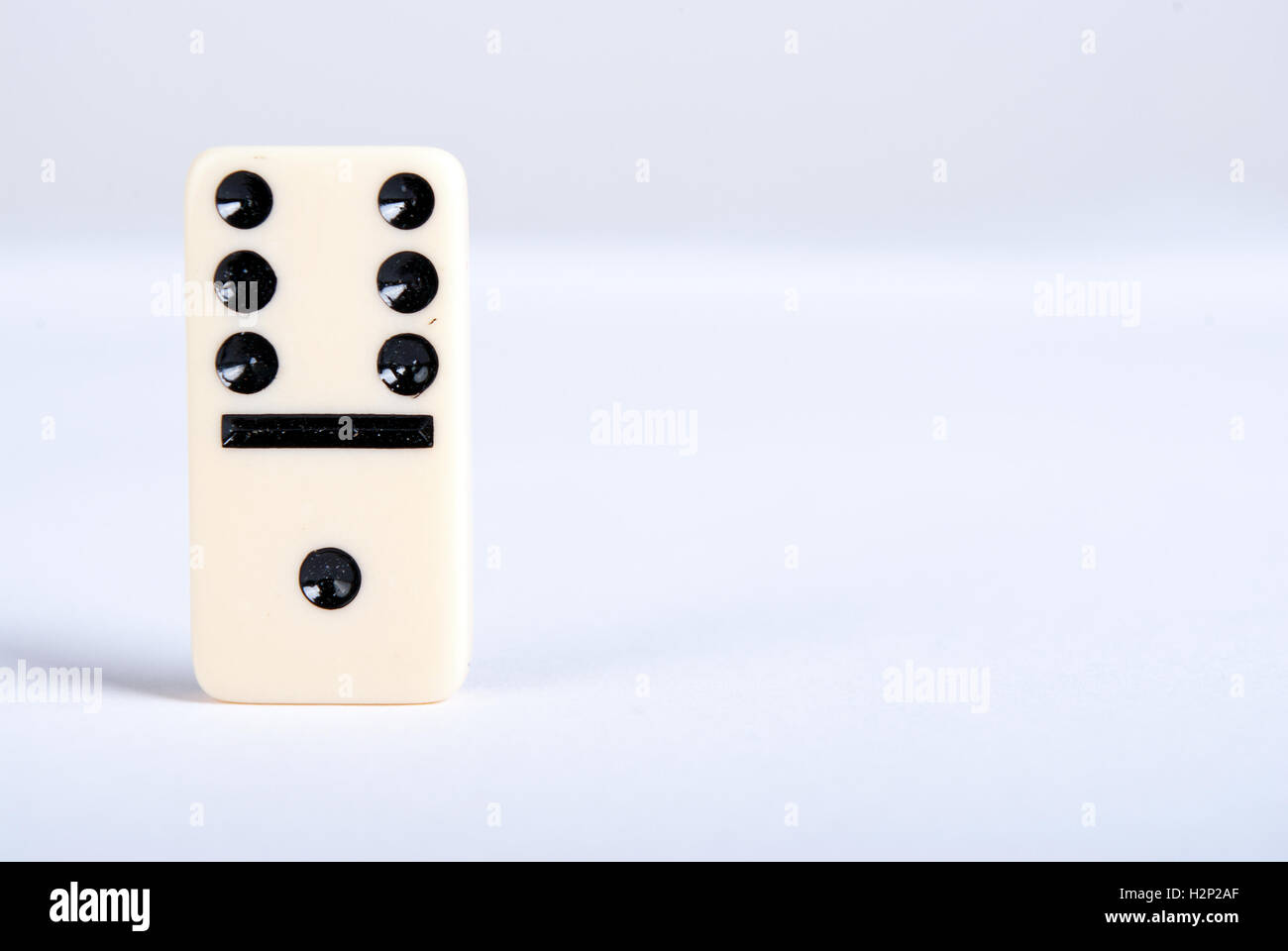 one domino cube on white background Stock Photo - Alamy