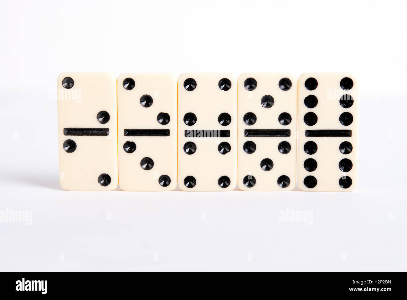 some domino cubes in one row Stock Photo - Alamy