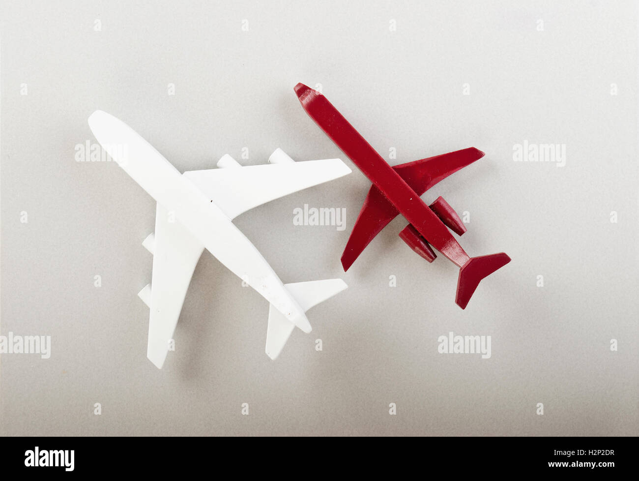 red aircraft of airplane on red color and white color Stock Photo - Alamy