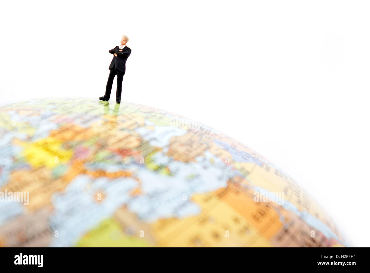 business man standing on earth Stock Photo - Alamy