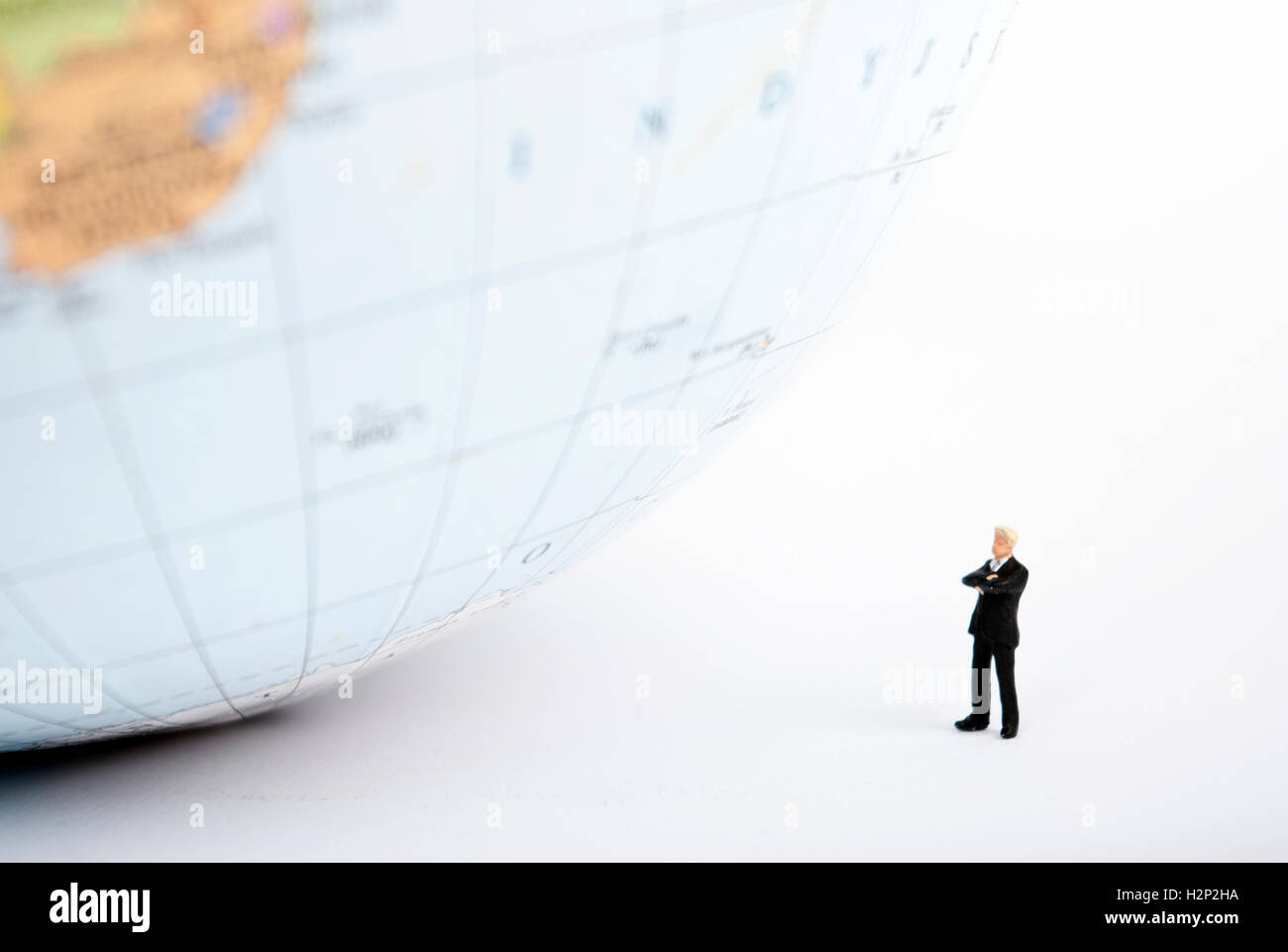 business man standing on earth Stock Photo - Alamy