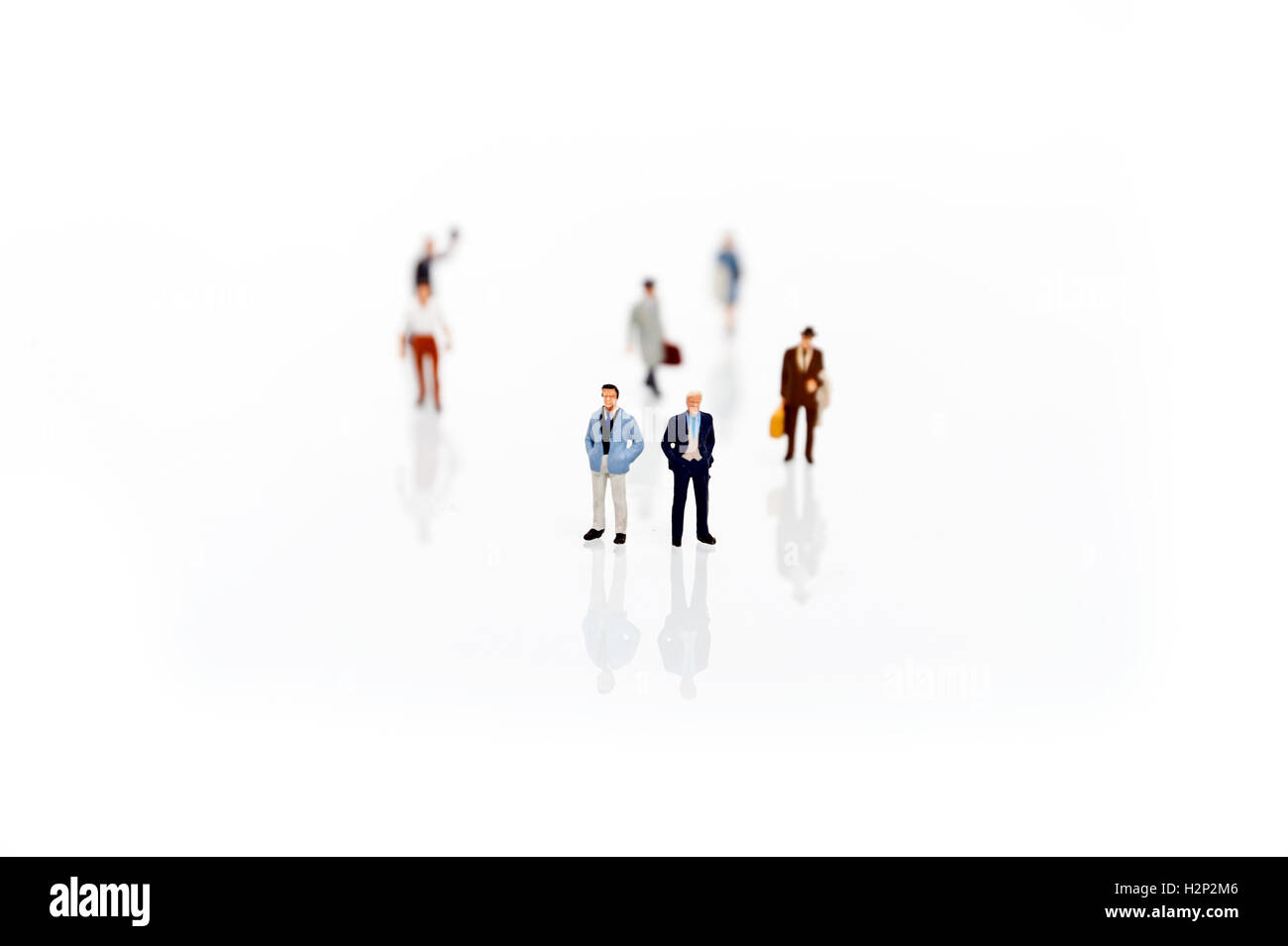 miniature man in one row Stock Photo - Alamy
