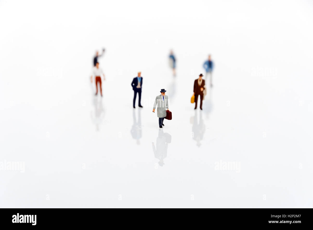 miniature man in one row Stock Photo - Alamy