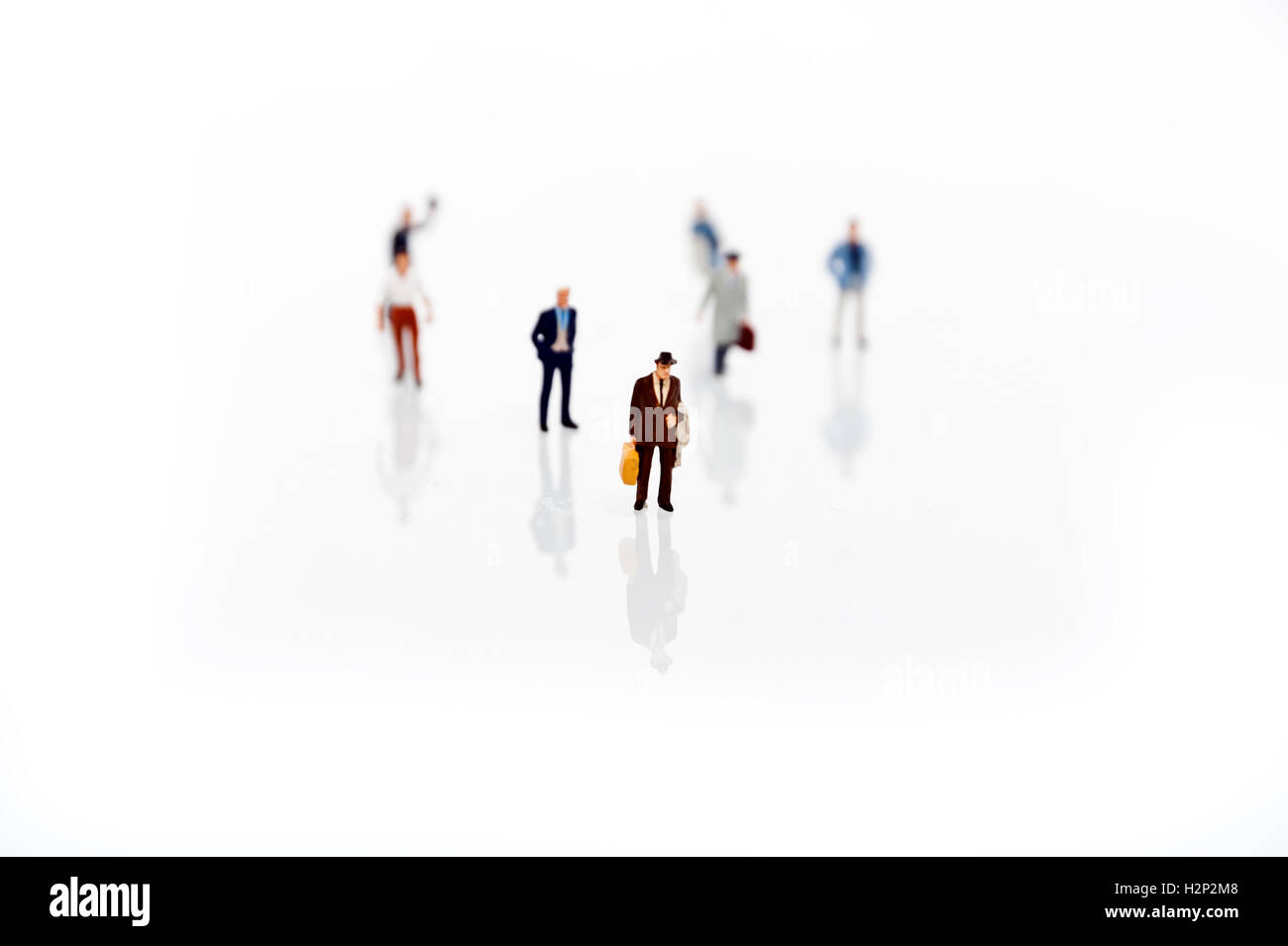 miniature man in one row Stock Photo - Alamy