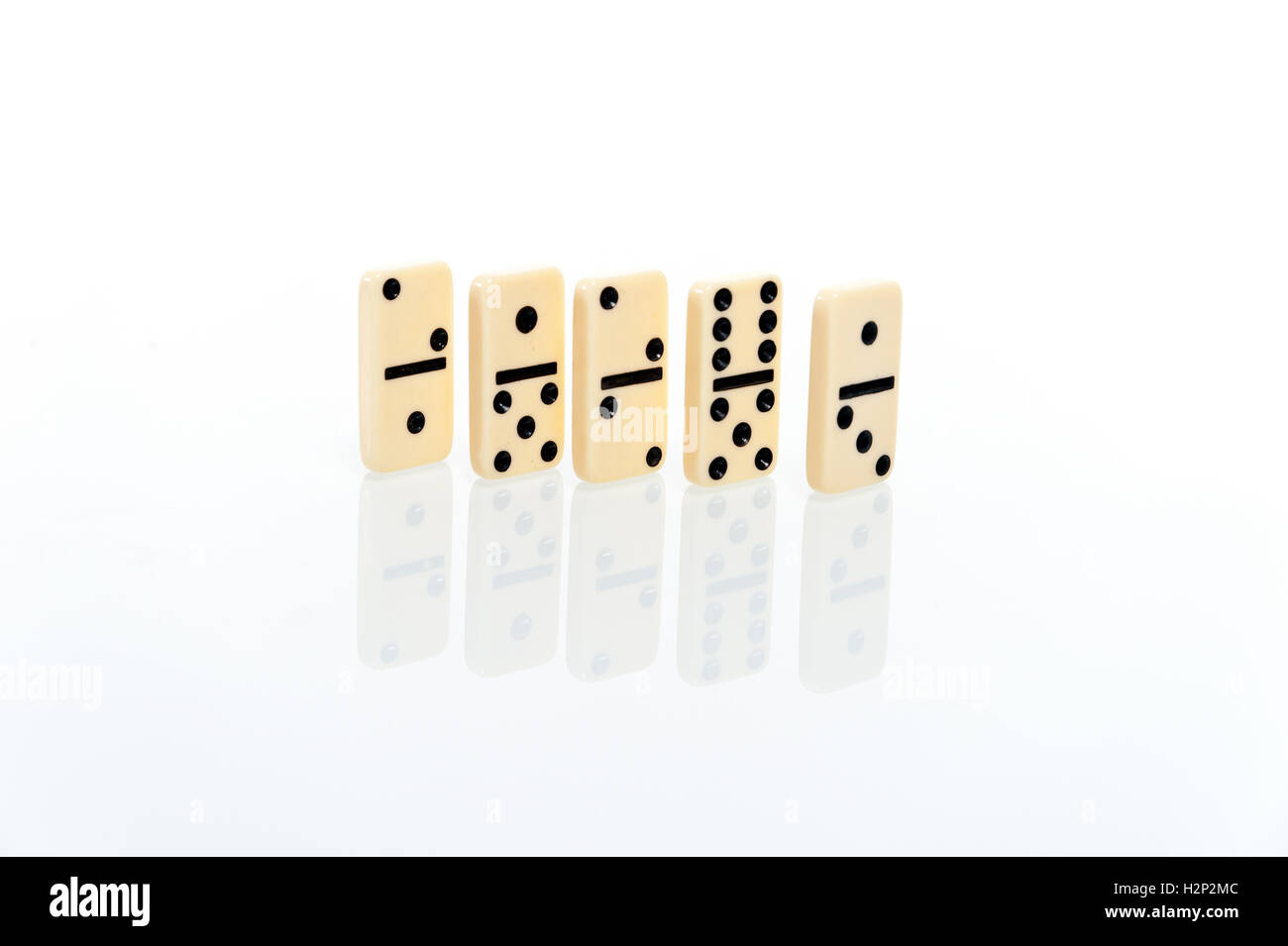 some domino bricks on white background Stock Photo - Alamy