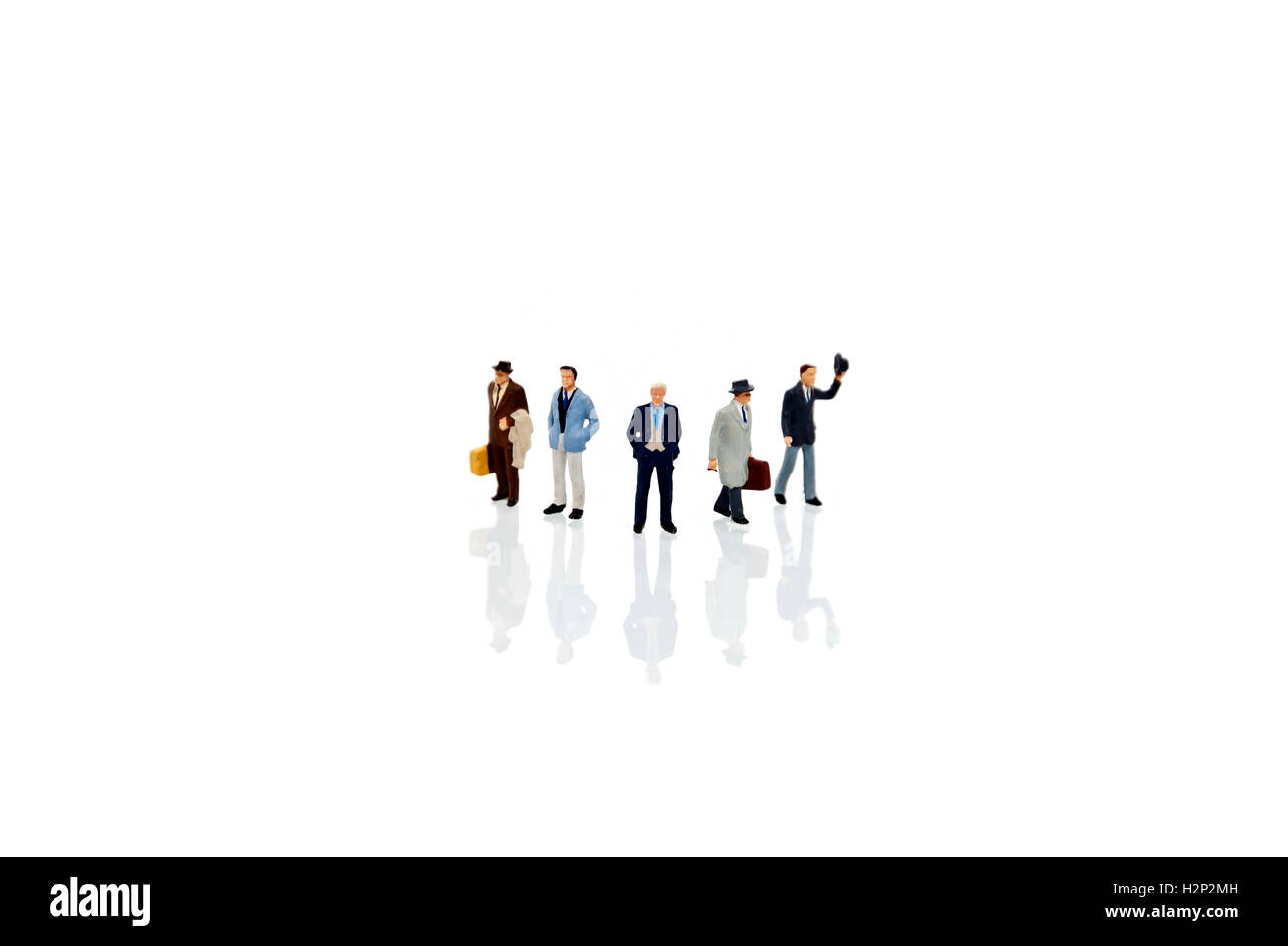 miniature man in one row Stock Photo - Alamy