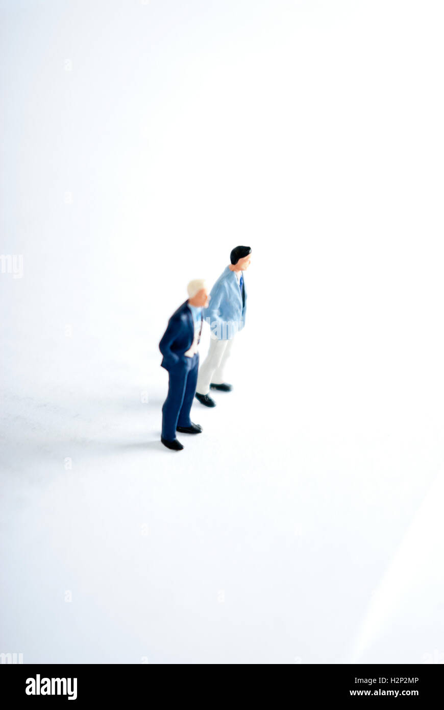 miniature people on white background Stock Photo - Alamy