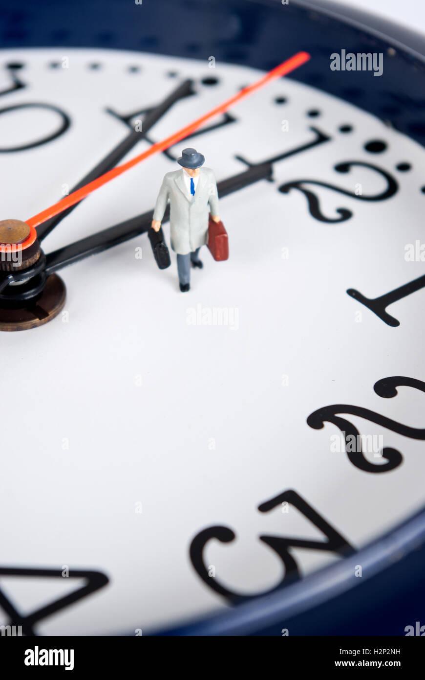 miniature man on the clock Stock Photo - Alamy