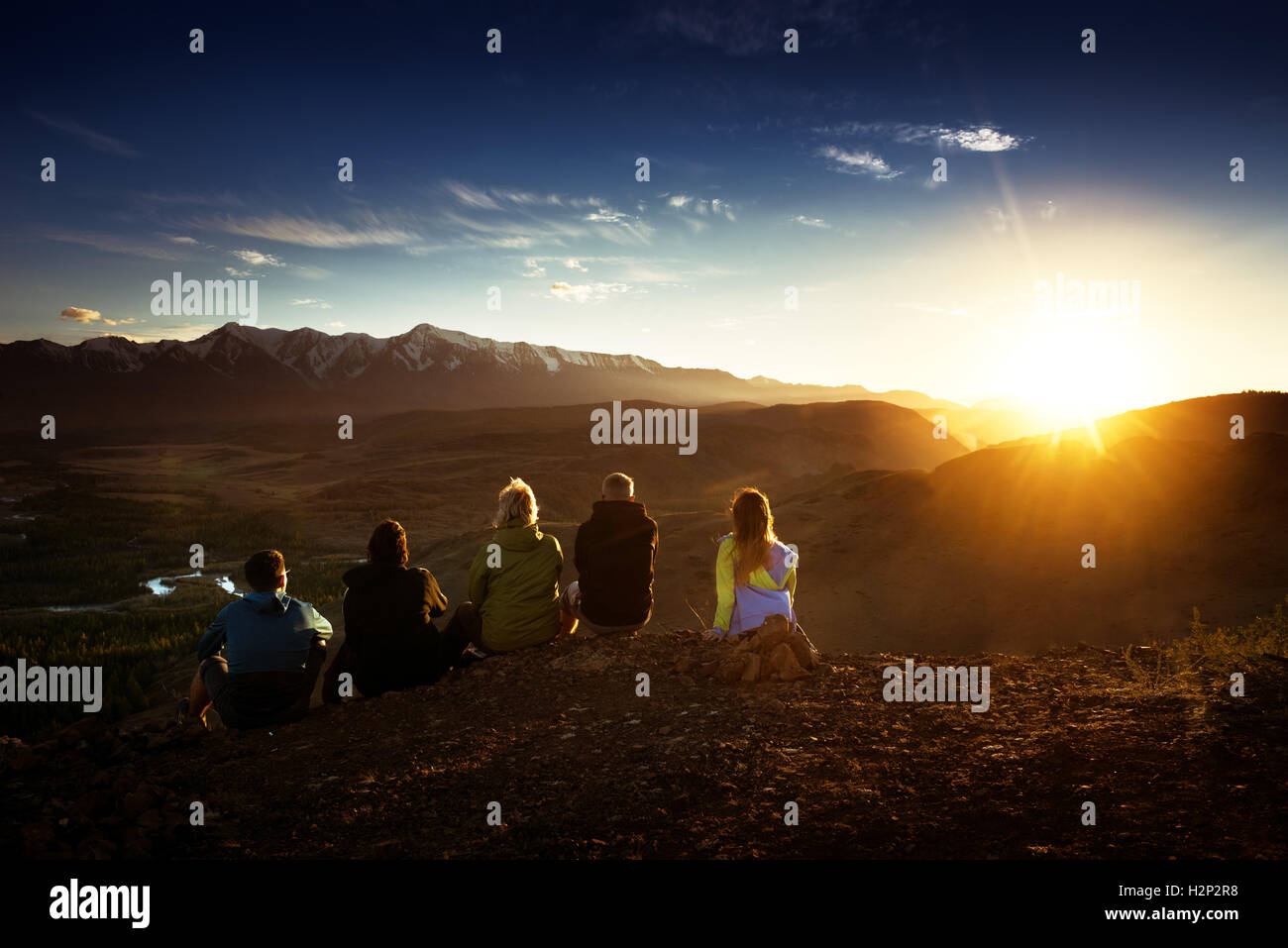 Group of friends on mountains background Stock Photo - Alamy