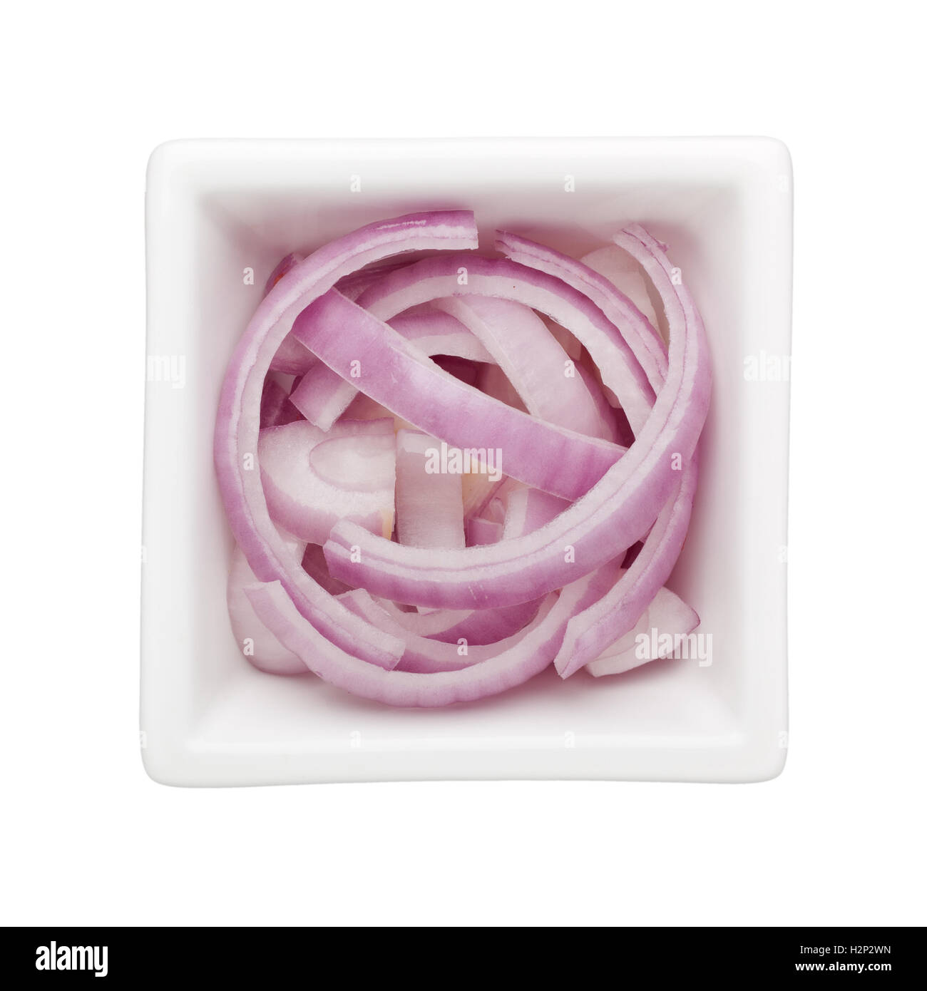 Sliced onion in a square bowl isolated on white background Stock Photo ...