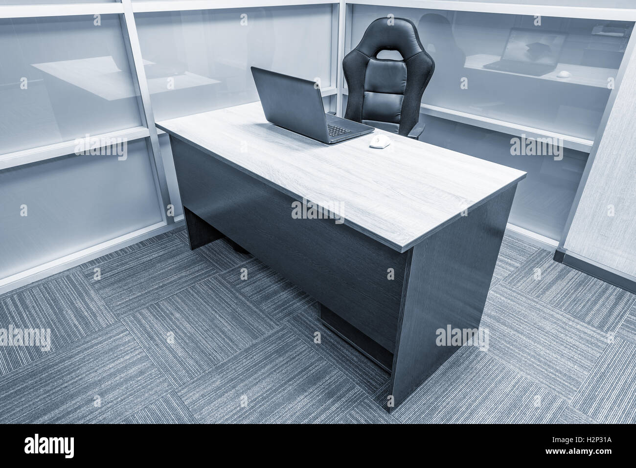 Office desk with note book and chair in the corner of the office Stock ...