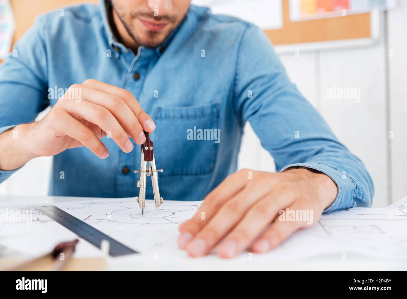 contractor with pencil drawing in blueprint Stock Photo - Alamy