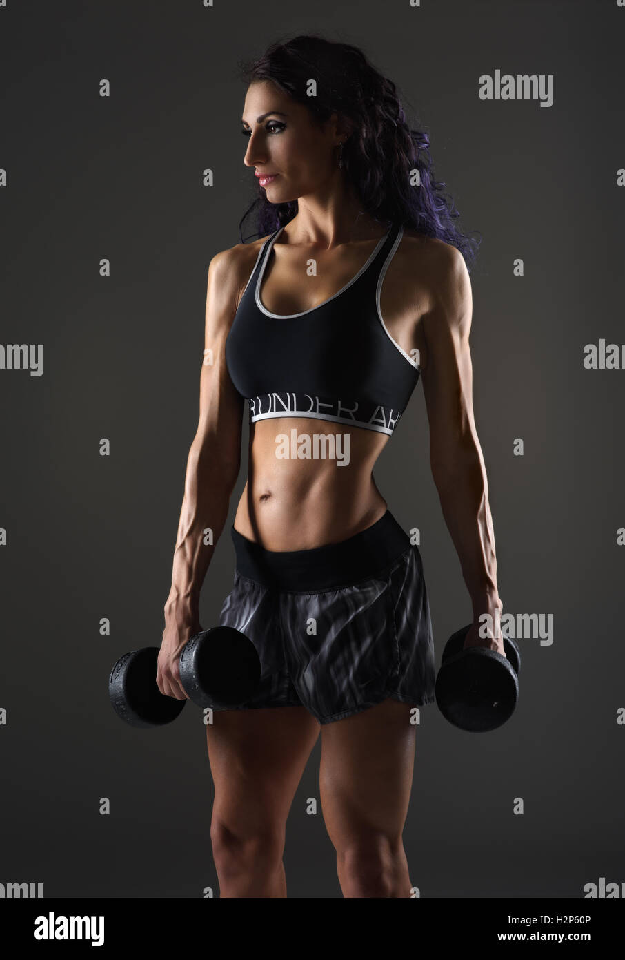 Female with weights ready to exercise Stock Photo - Alamy