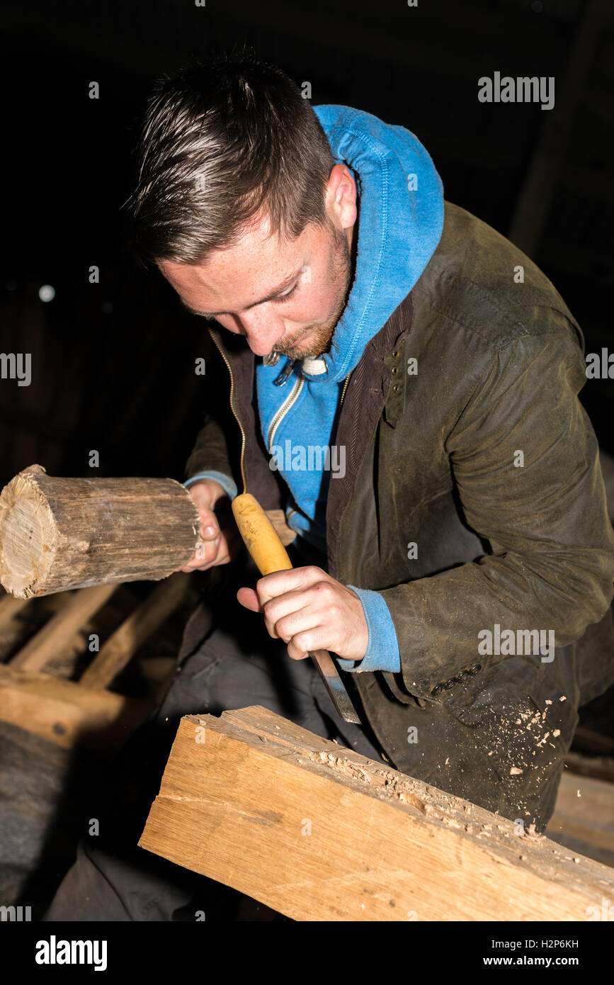 Carpenter working wiht hammer and chisel Stock Photo - Alamy