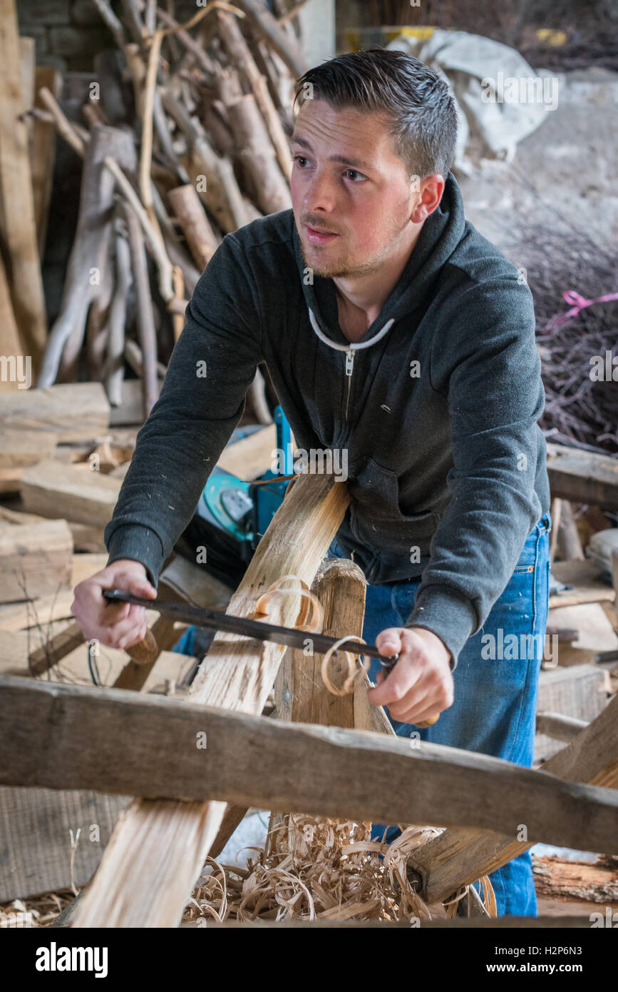 Carpenter shaping a piece of wood Stock Photo - Alamy