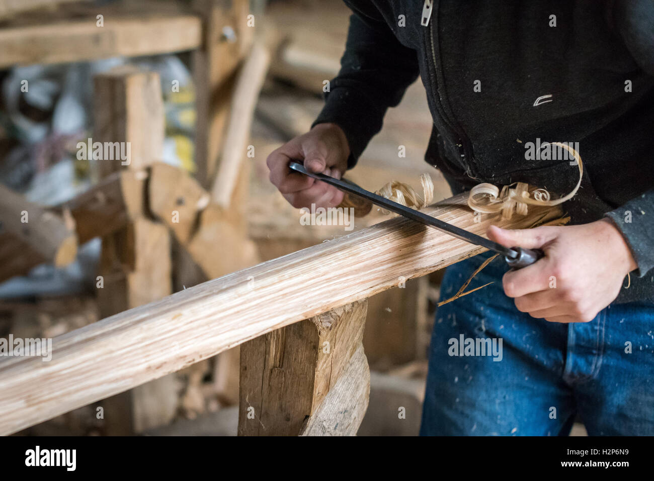 Carpenter shaping a piece of wood Stock Photo - Alamy