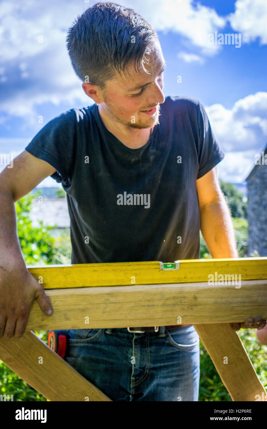 Checking a gate is level Stock Photo - Alamy