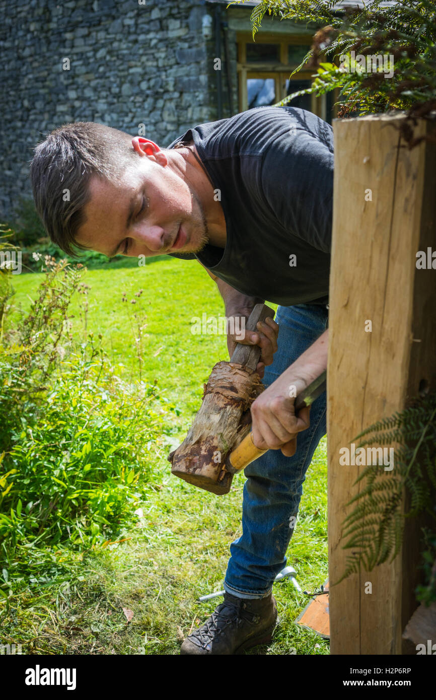 Hand holding chisel hammer hi-res stock photography and images - Alamy