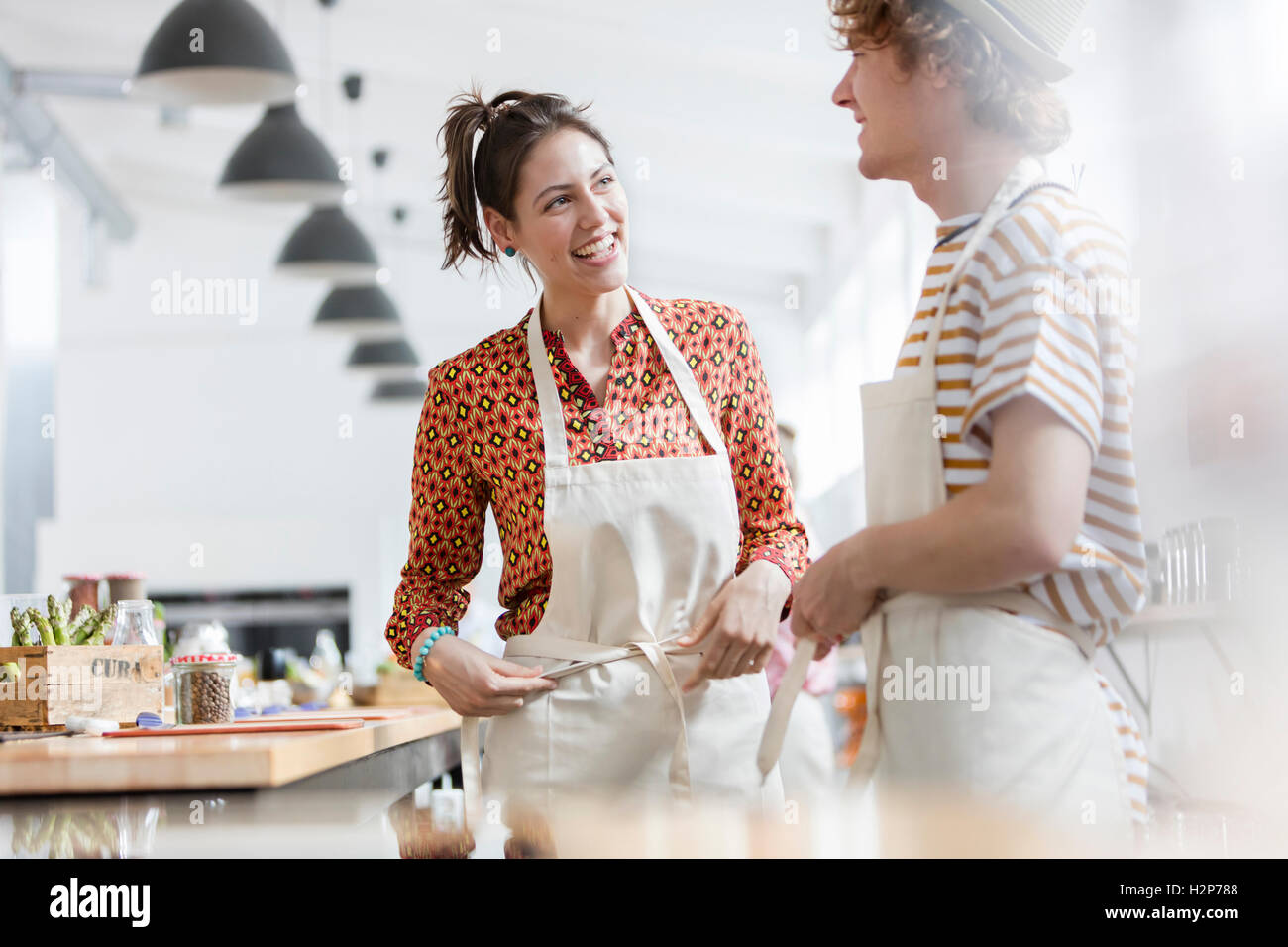 Couple enjoying cooking class in kitchen Stock Photo - Alamy