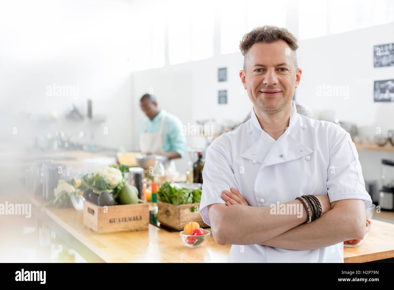Portrait smiling chef in commercial kitchen Stock Photo - Alamy