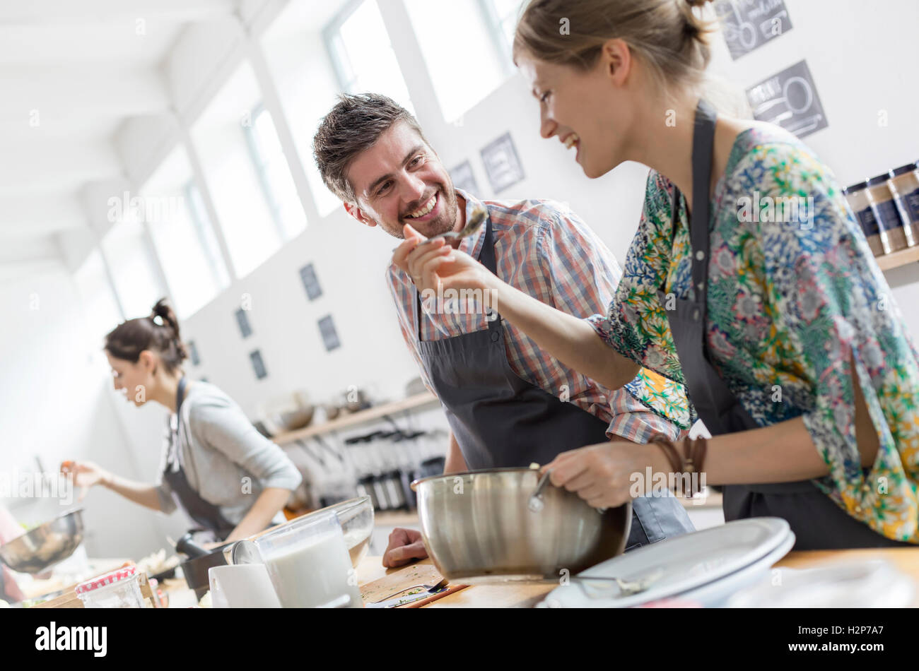 Couple enjoying cooking class kitchen Stock Photo - Alamy